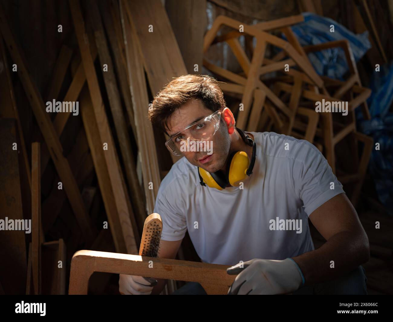 Professional Carpenter happy working to making woodcraft furniture in ...