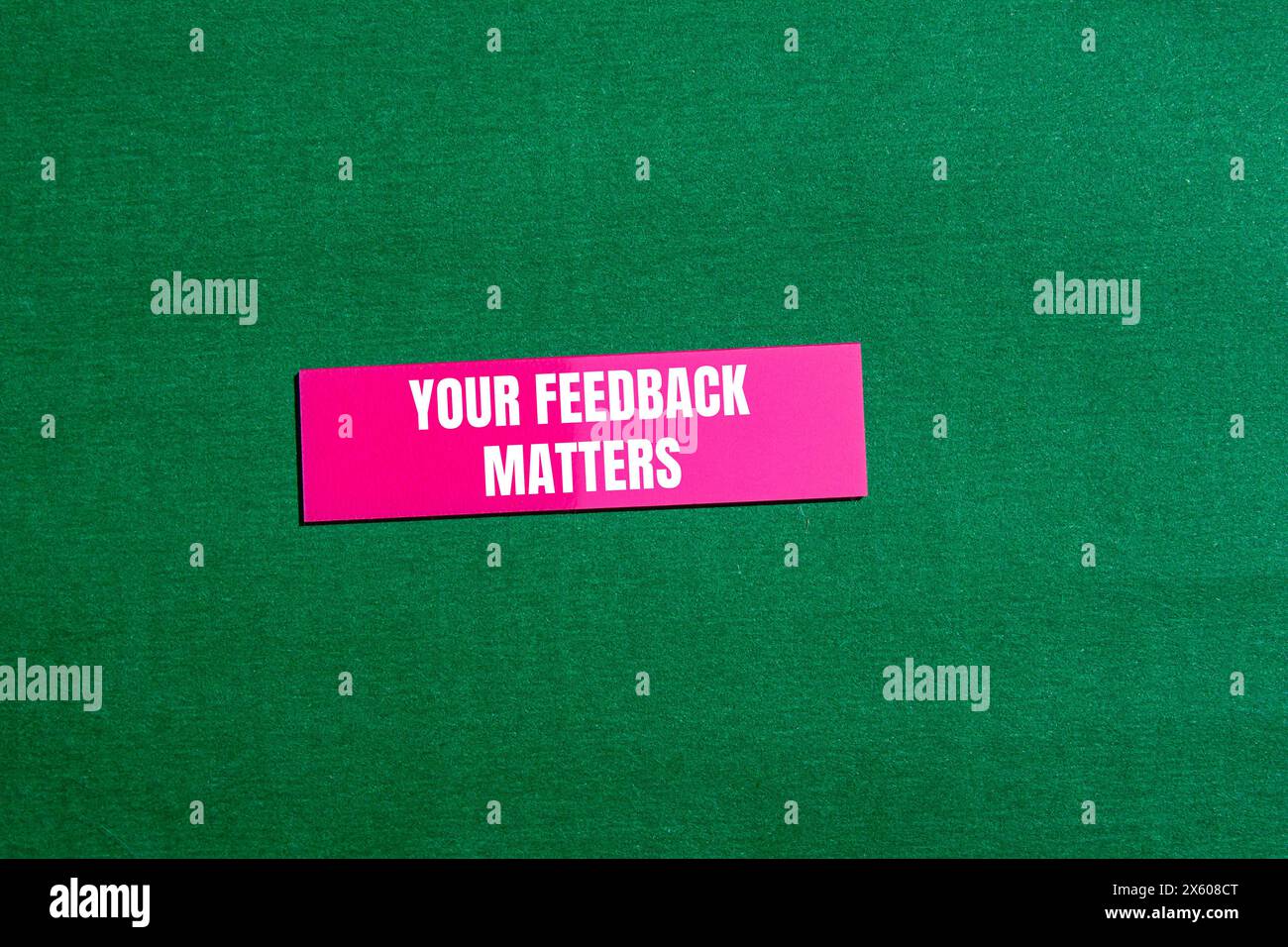 Your feedback matters words written on pink paper sticker with green ...