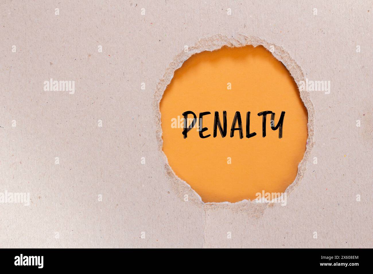 Penalty word written on ripped paper with orange background. Conceptual ...