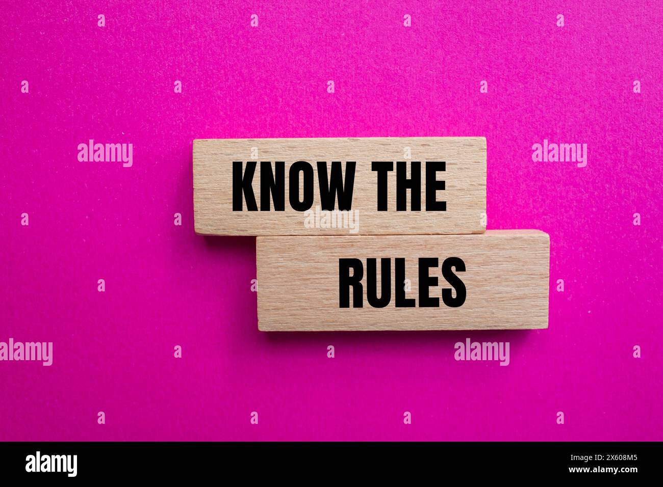 Know the rules words written on wooden blocks with pink background ...