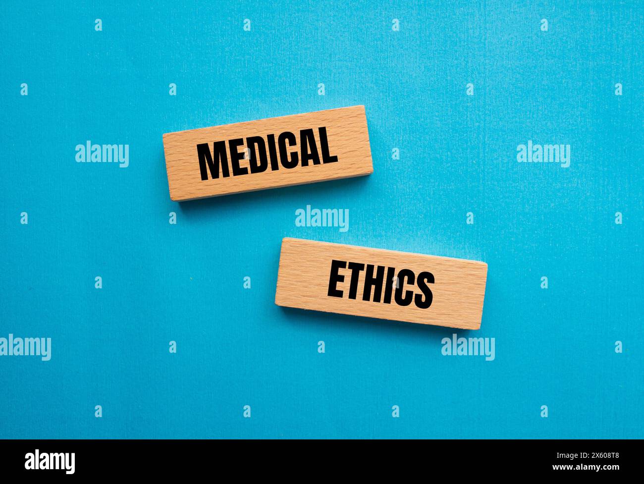 Medical ethics words written on wooden blocks with blue background ...