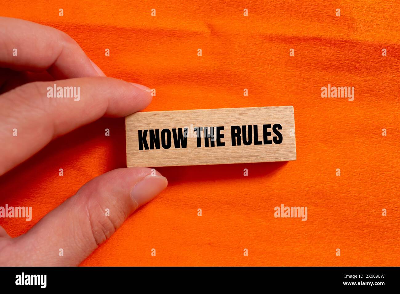 Know the rules words written on wooden block with orange background ...