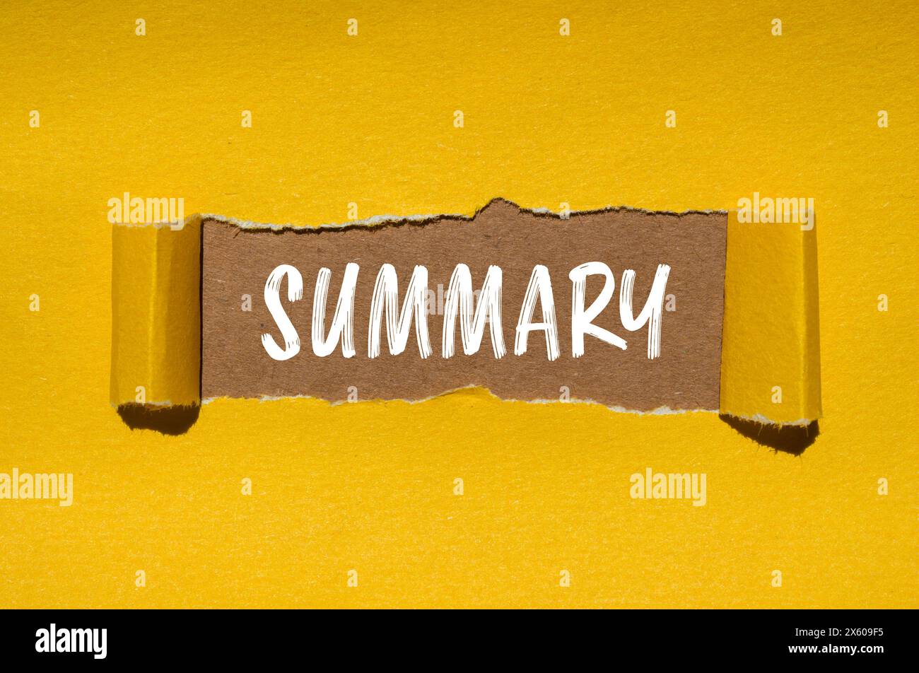 Summary word written on ripped yellow paper with brown background ...