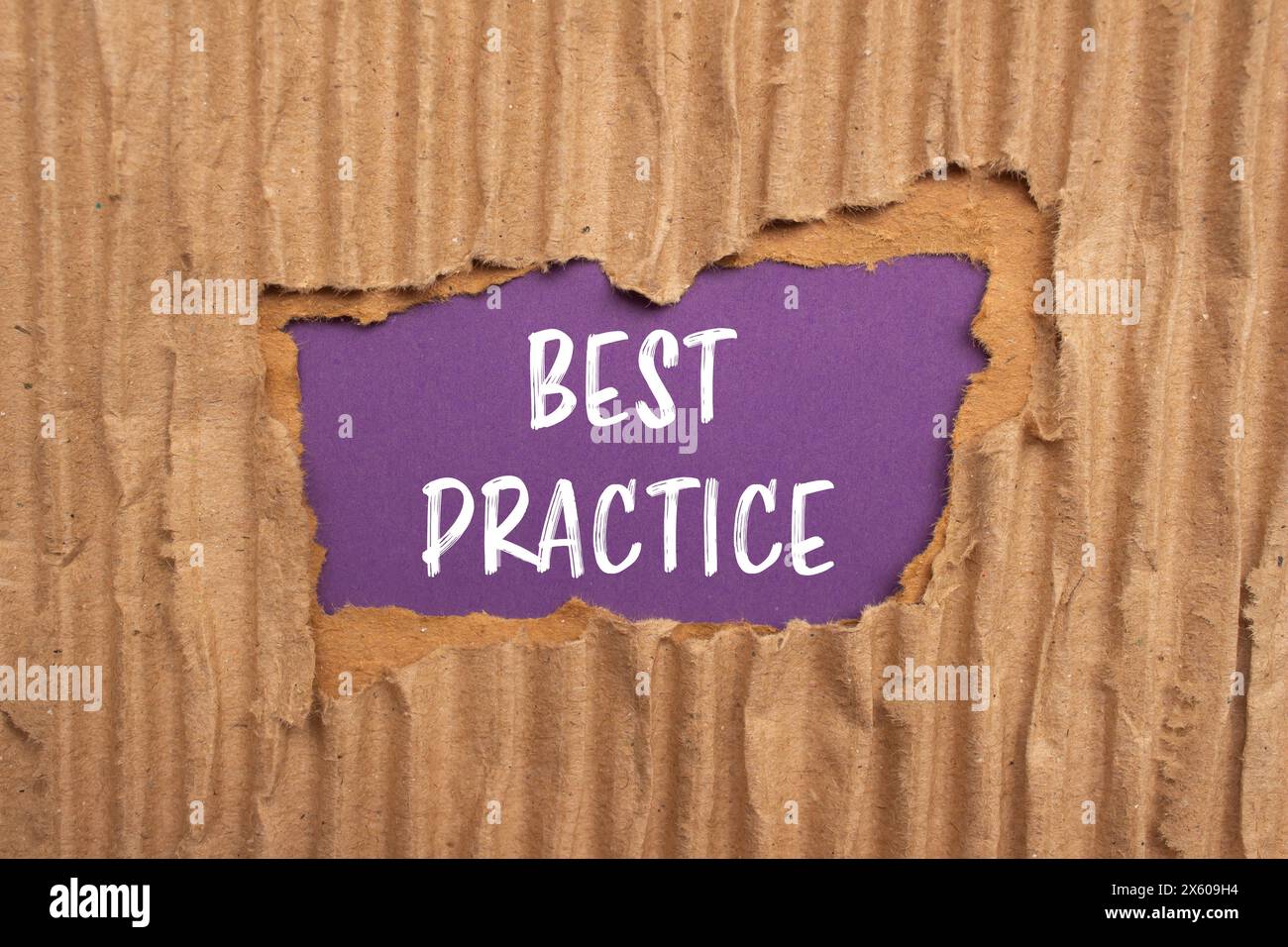 Best practice words written on ripped cardboard paper with purple ...