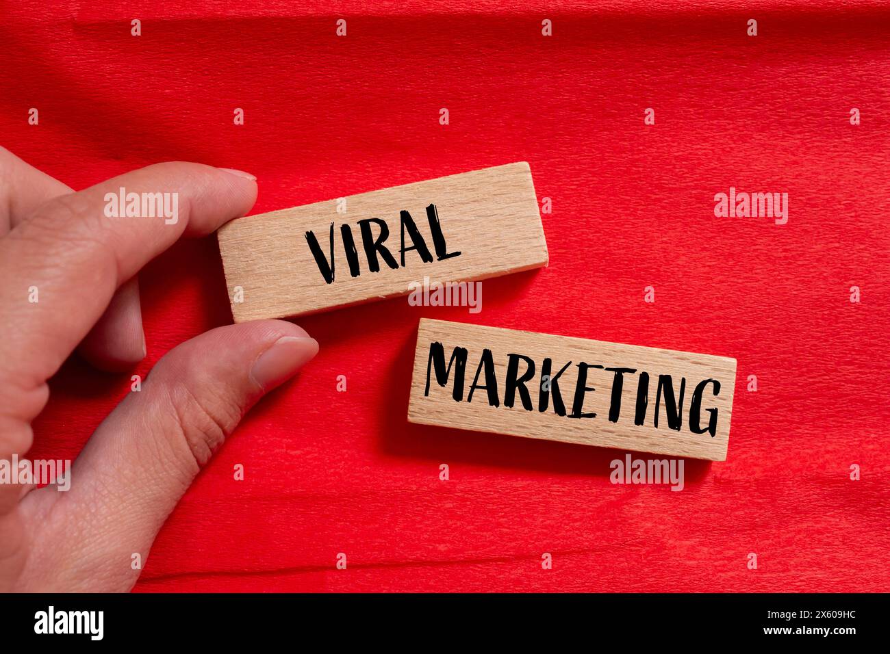 Viral marketing words written on wooden blocks with red background ...
