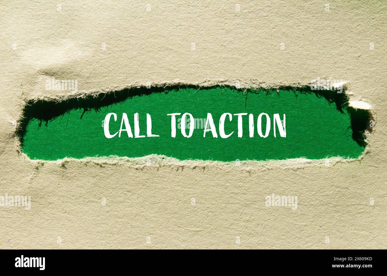 Call to action words written on ripped paper with green background ...