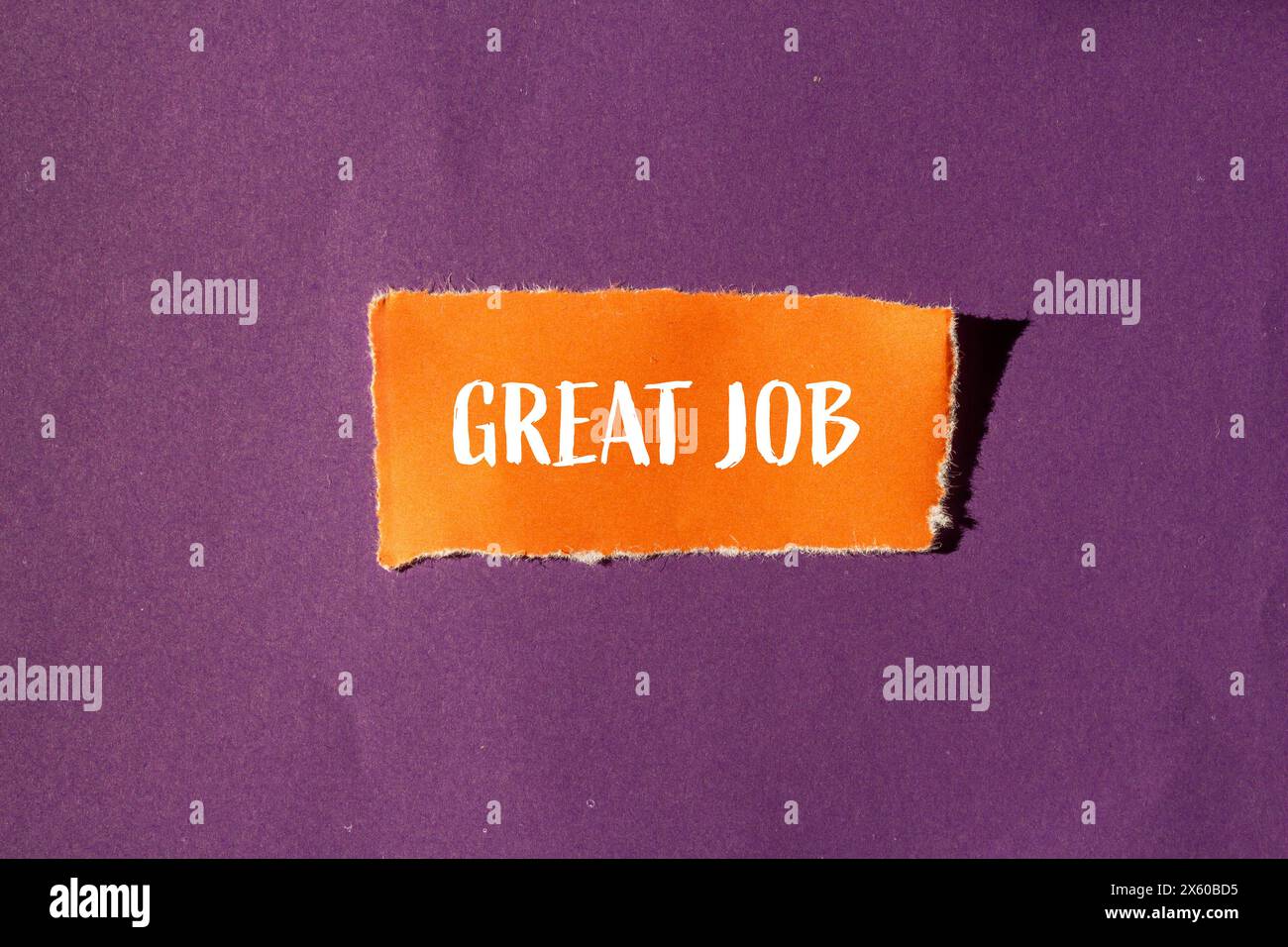 Great job written on ripped orange paper with purple background ...