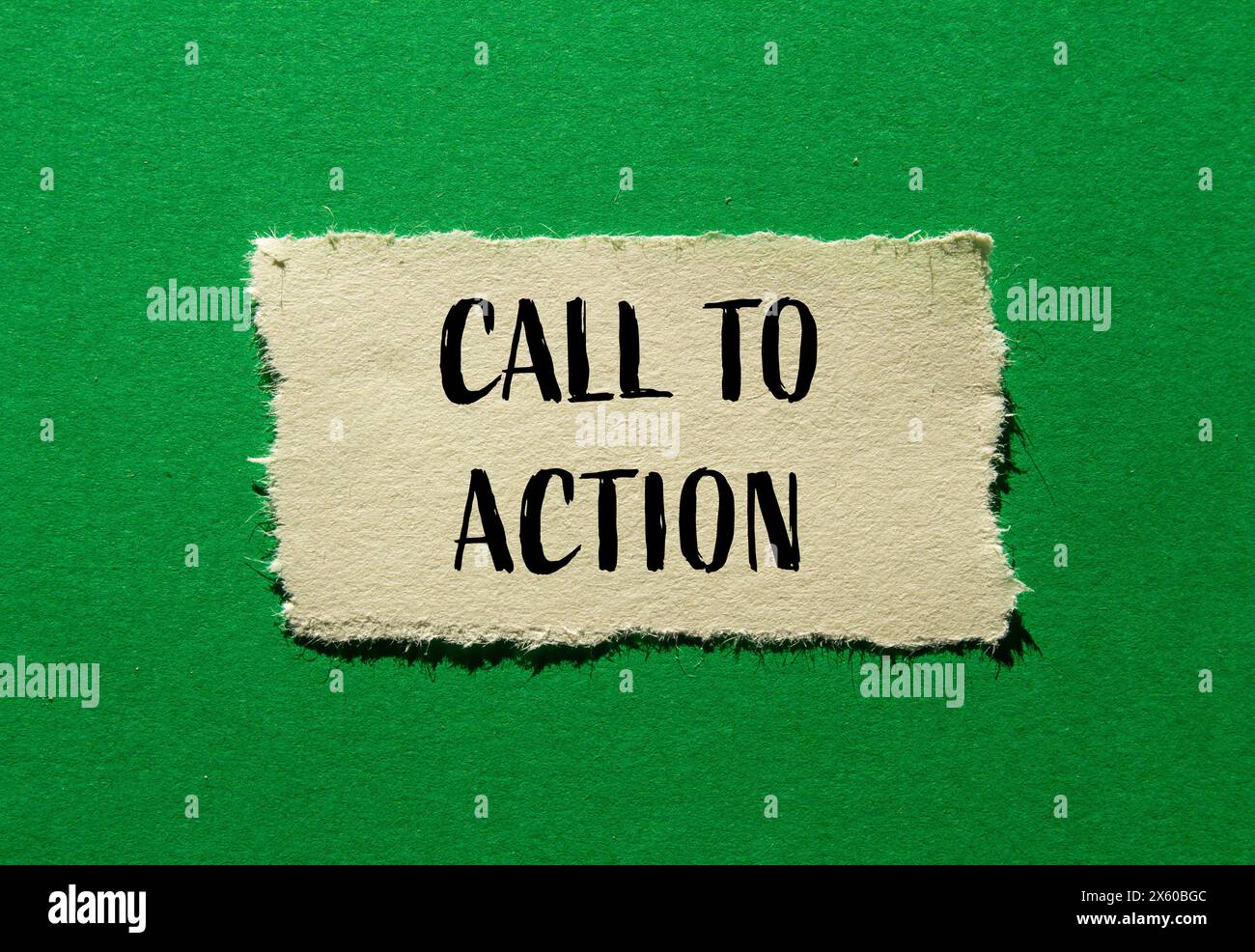 Call to action words written on ripped paper with green background ...