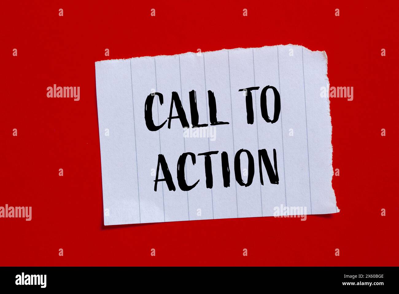 Call to action words written on ripped paper with red background ...