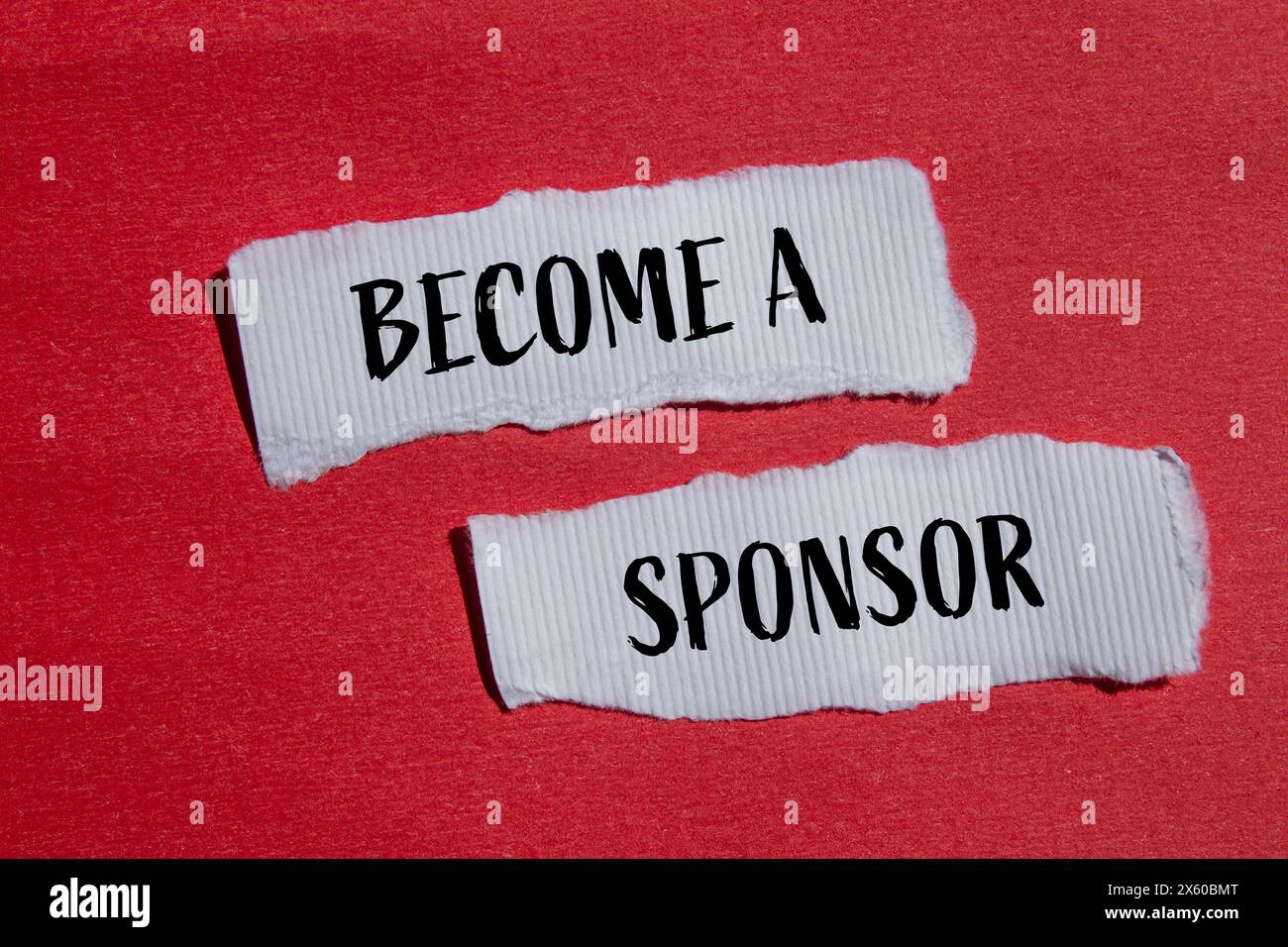 Become a sponsor words written on ripped white paper pieces with red ...