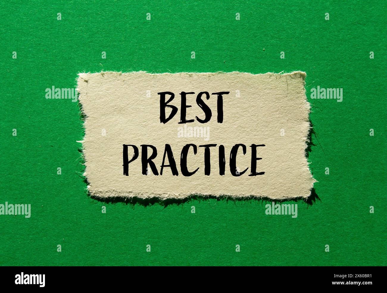 Best practice words written on ripped paper with green background ...