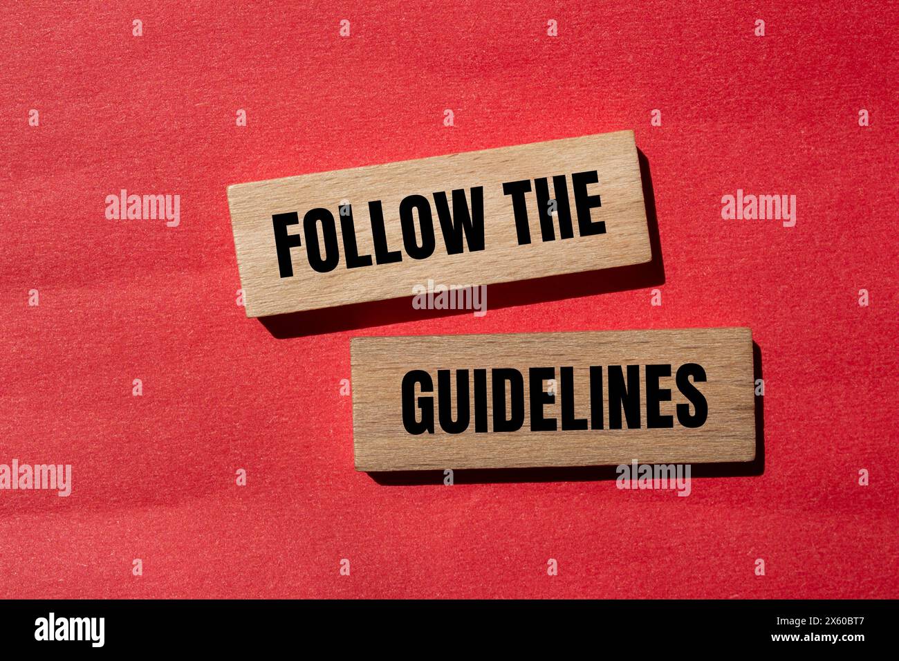Follow the guidelines words written on wooden blocks with red ... Follow the guidelines words written on wooden blocks with red ...