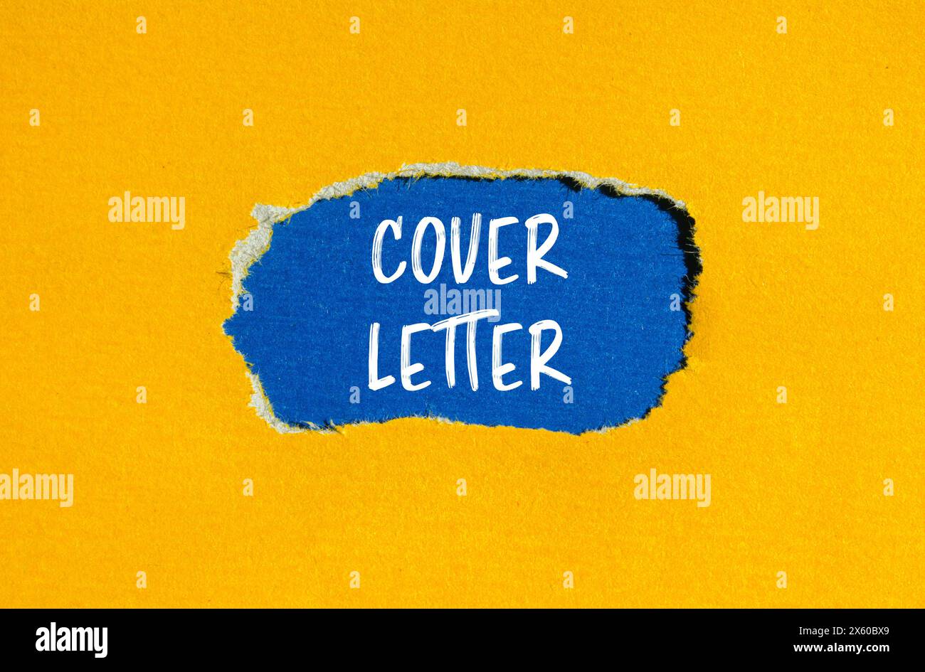 Cover letter words written on ripped yellow paper with blue background. Conceptual cover letter ...