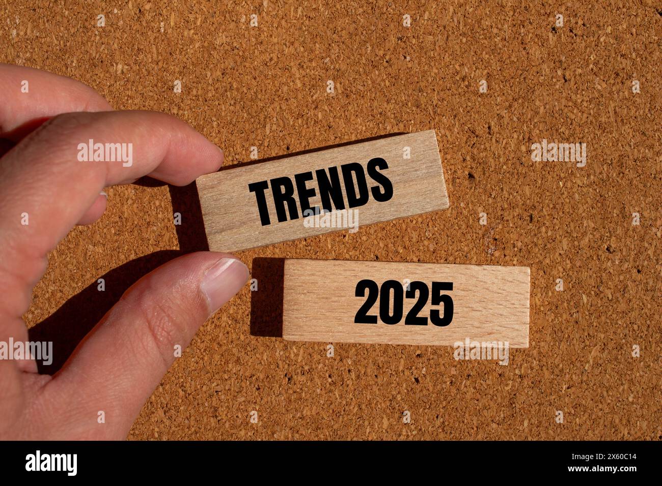 Trends 2025 words written on wooden blocks with brown background. Conceptual trends 2025 symbol ...