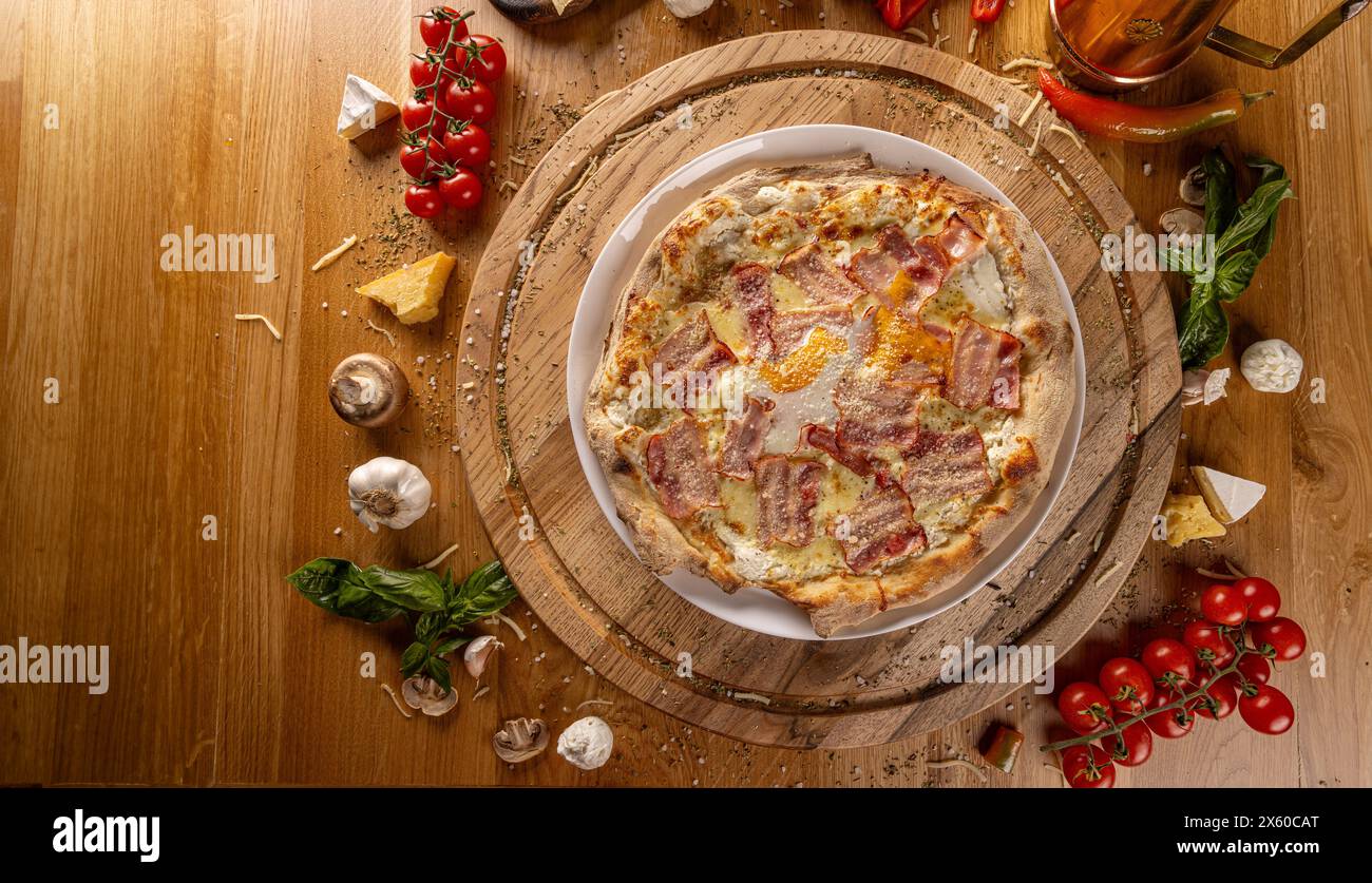 Rustic bacon pizza on wooden table, top view Stock Photo - Alamy