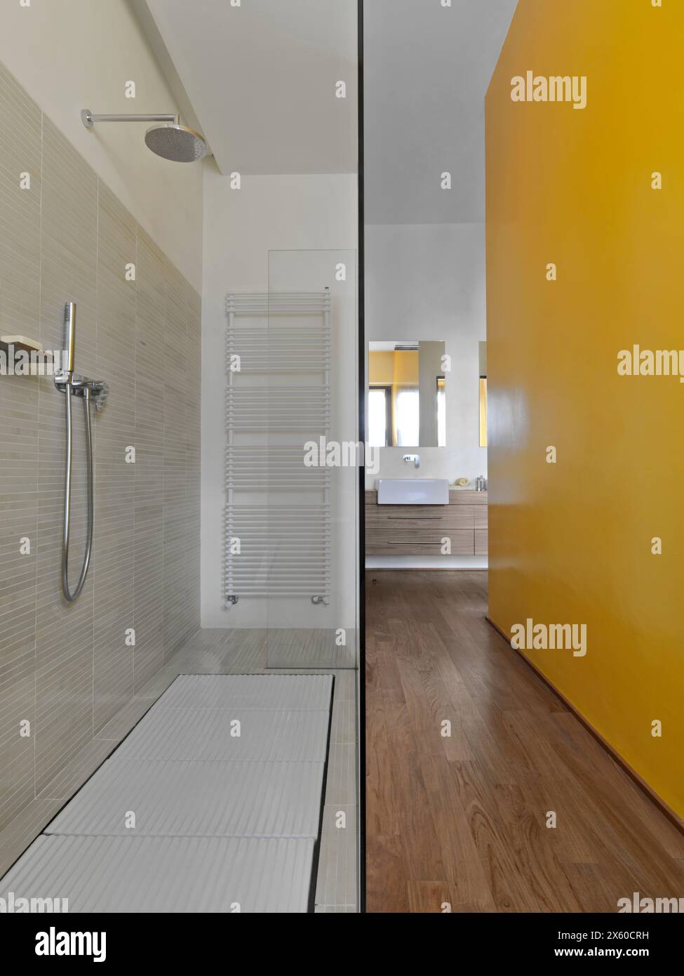 modern bathroom interior to the left the large shower cubicle with ...