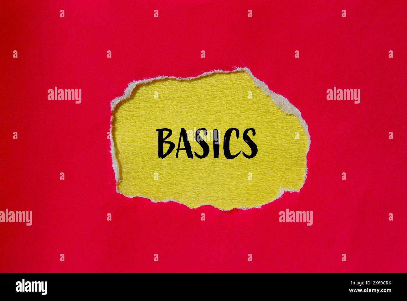 Basics word written on ripped red paper with yellow background. Conceptual basics word symbol ...