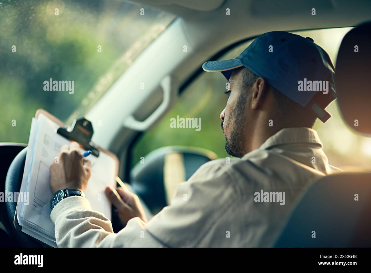 Delivery man, checklist and writing in van for logistics, schedule and ...