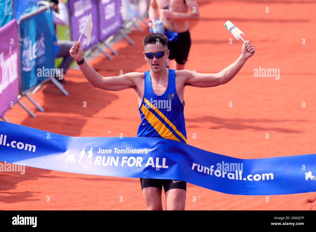 Joe Sagar crosses the line to win the Rob Burrow Leeds Marathon ...