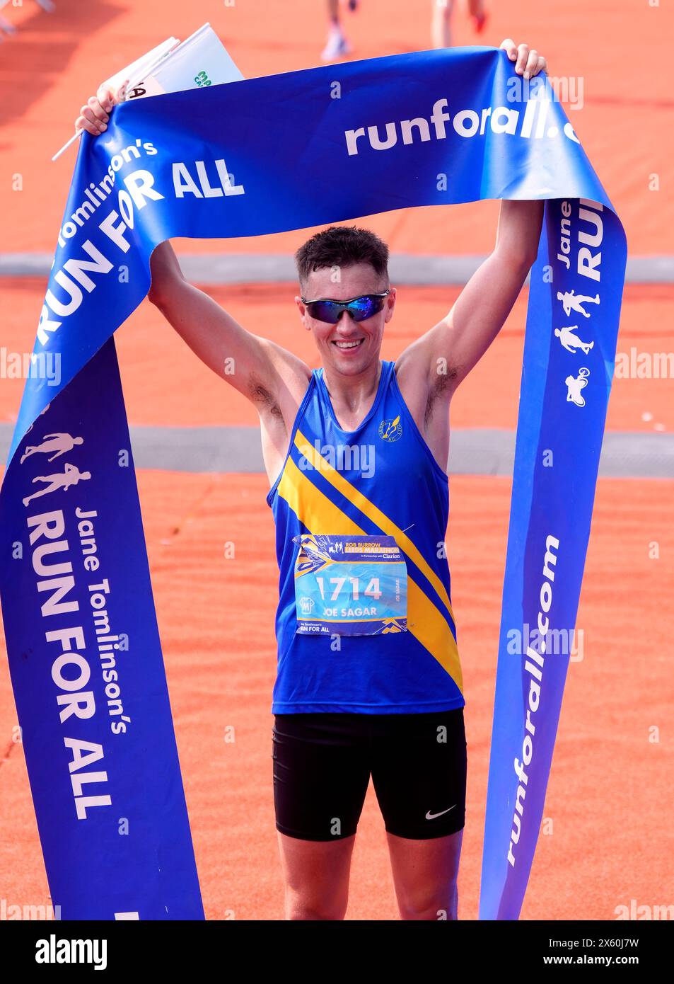 Joe Sagar celebrates winning the Rob Burrow Leeds Marathon. Picture ...