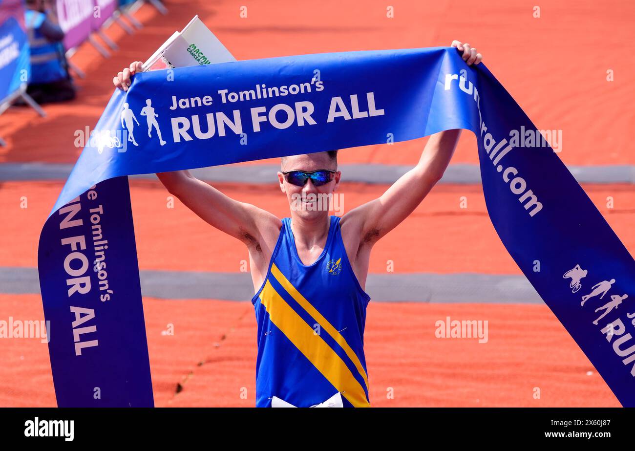 Joe Sagar celebrates winning the Rob Burrow Leeds Marathon. Picture ...