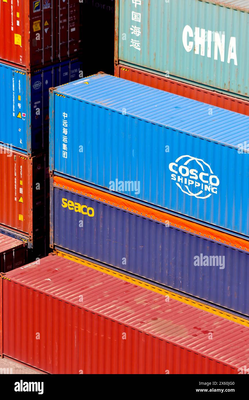 Selective crop of large number of shipping containers stacked on the ...