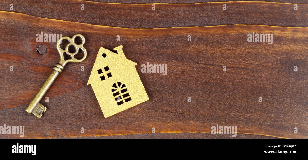 House and gold key. Real estate, home ownership banner Stock Photo - Alamy