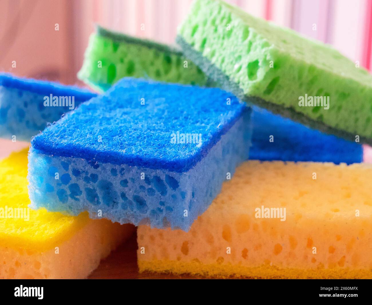 Household Scrubbing Tools. Multi-colored sponges, focus on absorbency ...