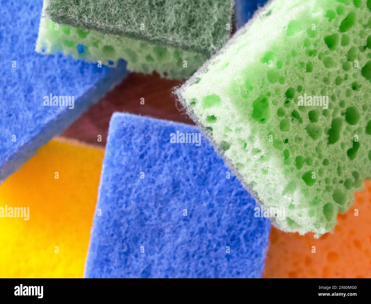 Hygiene Essentials. Multi-colored sponges, close-up view of porous ...