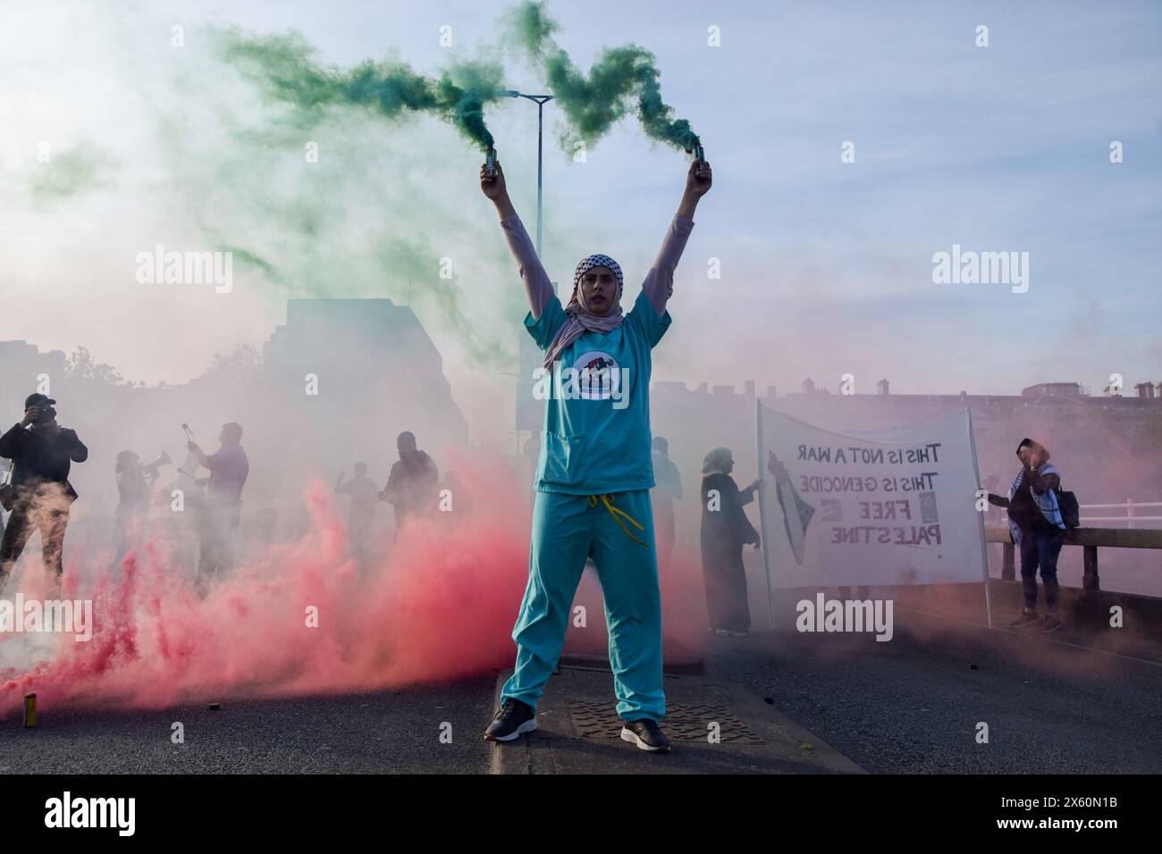London, UK. 11th May 2024. Pro-Palestine protesters set off smoke ...