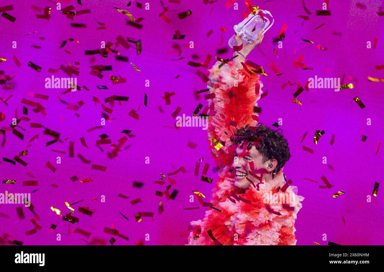 12 May 2024, Sweden, Malmö: Nemo from Switzerland holds up the broken ...