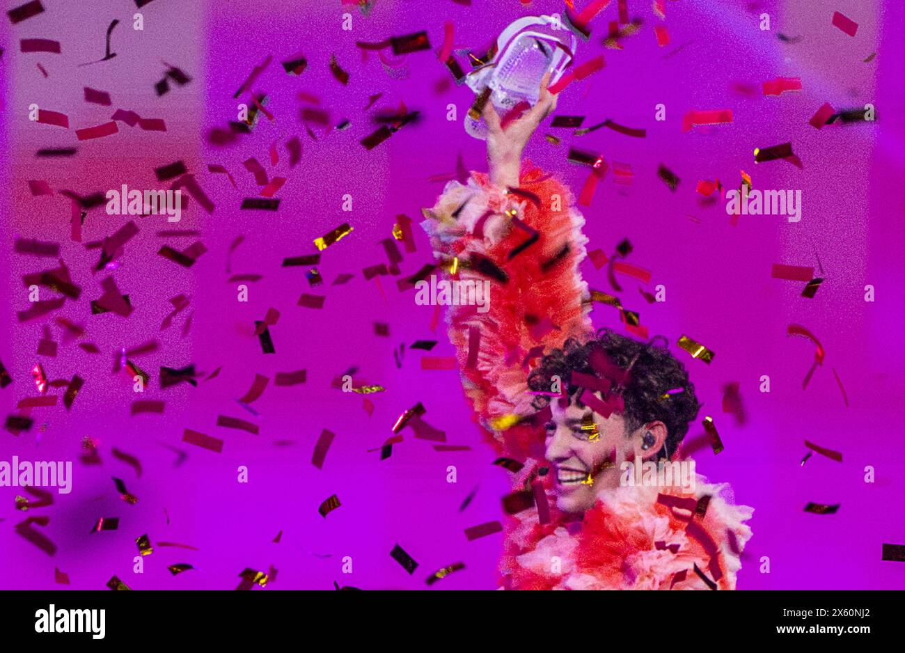 12 May 2024, Sweden, Malmö: Nemo from Switzerland holds up the broken ...