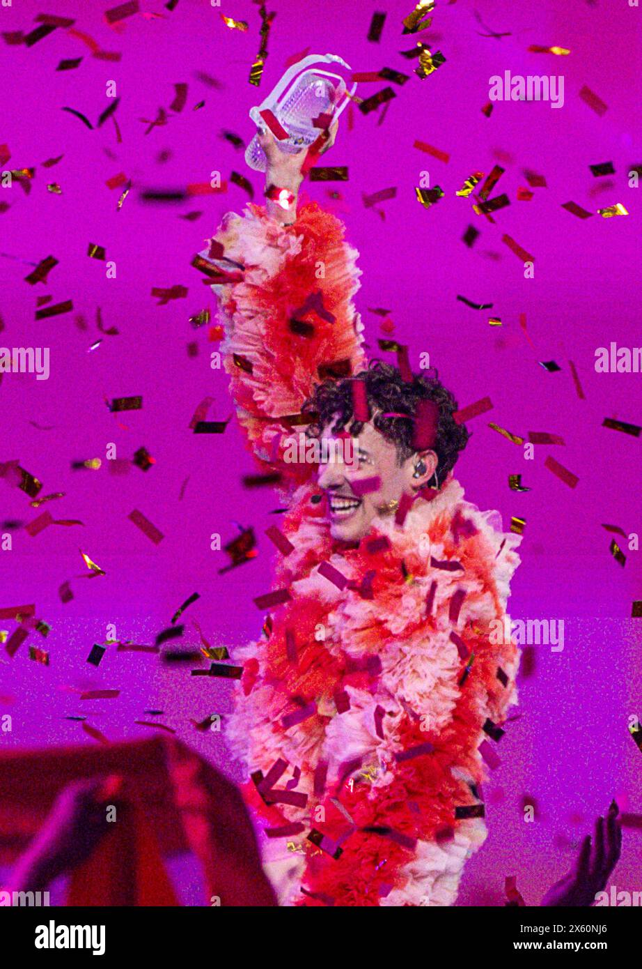 12 May 2024, Sweden, Malmö: Nemo from Switzerland holds up the broken ...