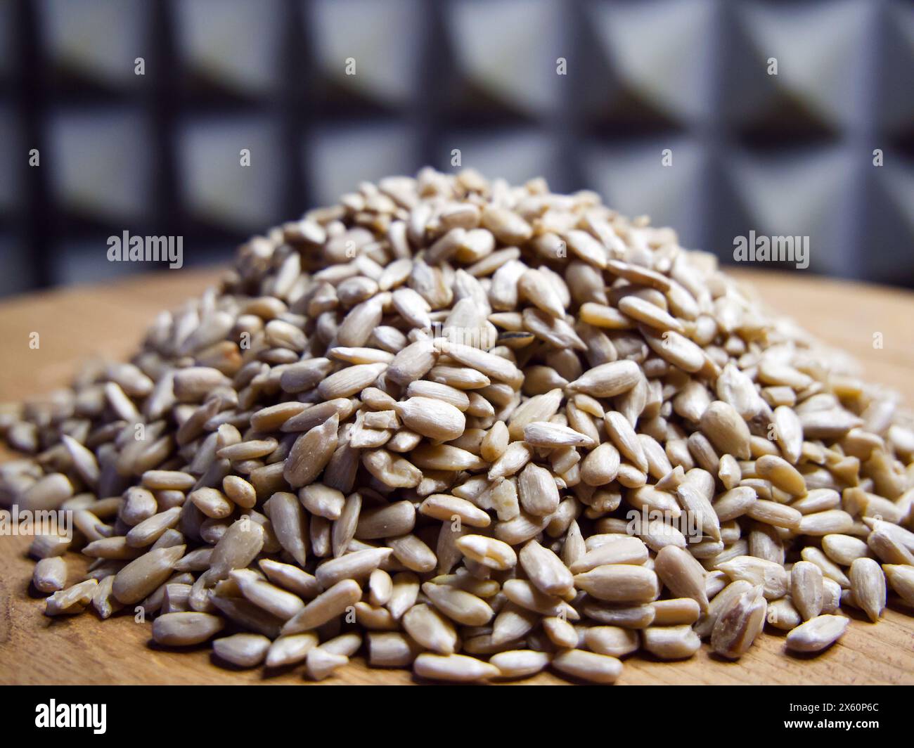 Sunflower Seeds on Wood. Shelled sunflower seeds on a wooden surface ...