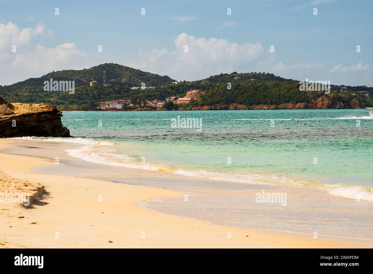 Caribbean beach with white sand, deep blue sky and turquoise water ...
