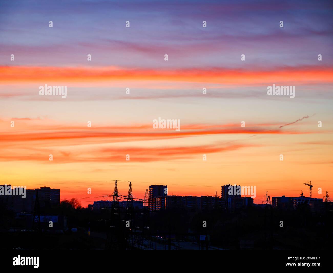 Sunset over city with orange-purple sky, perfect for reflective moods ...