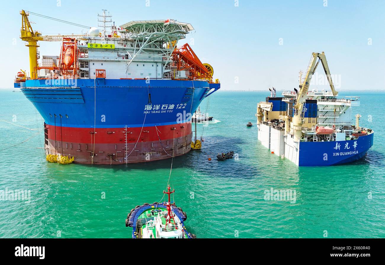 QINGDAO, CHINA - MAY 12, 2024 - The "Haikui No. 1" is loaded on a ship ...