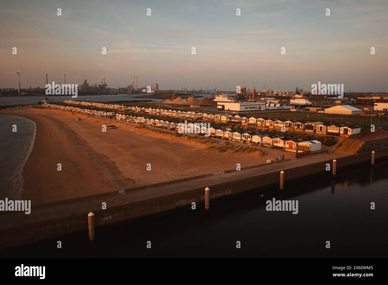 Beach Huts At Sunset Along The Coastline In IJmuiden Netherlands With beach-huts-at-sunset-along-the-coastline-in-ijmuiden-netherlands-with