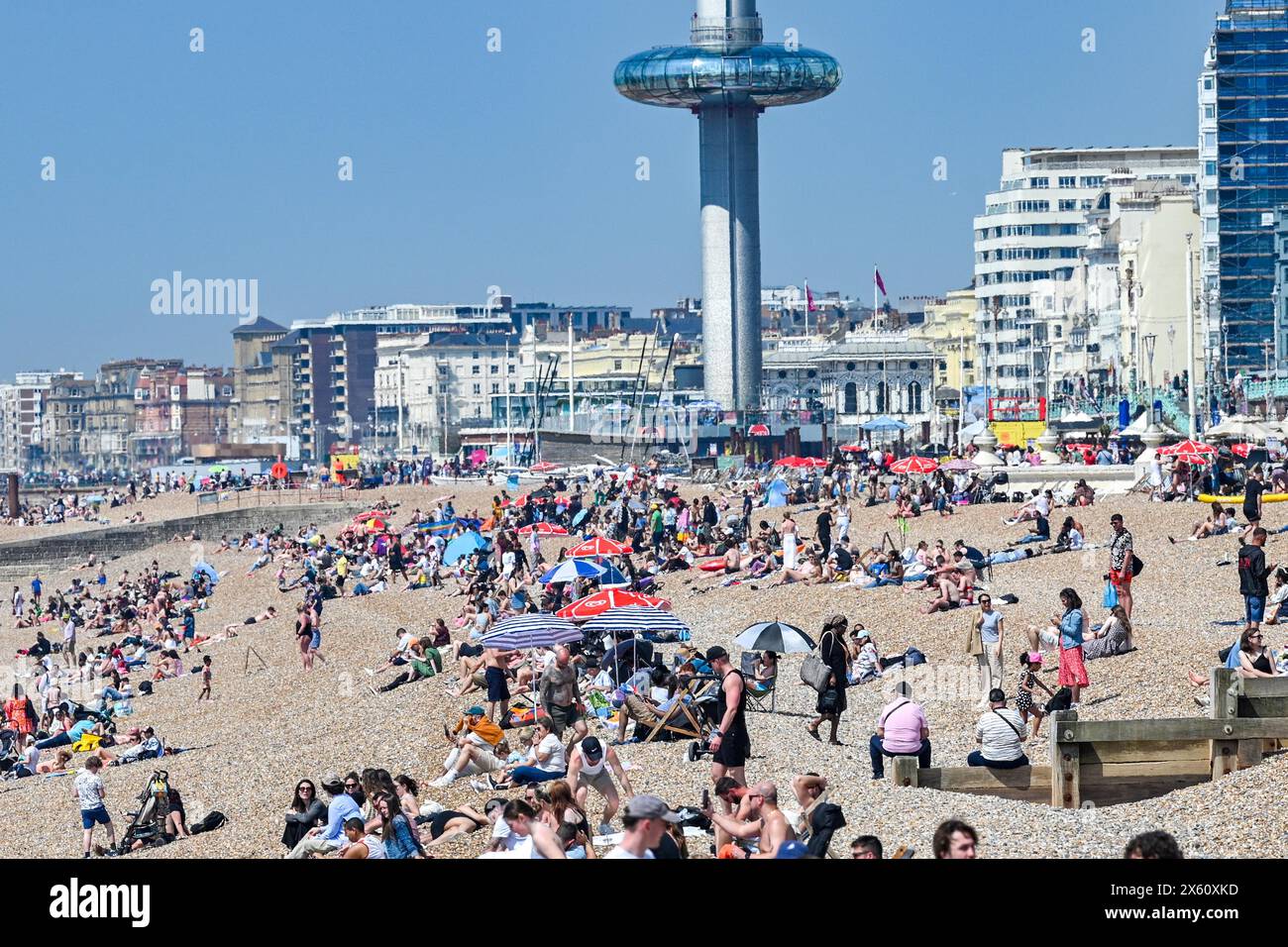 Brighton UK 12th May 2024 - Visitors enjoy the hot sunny weather on ...
