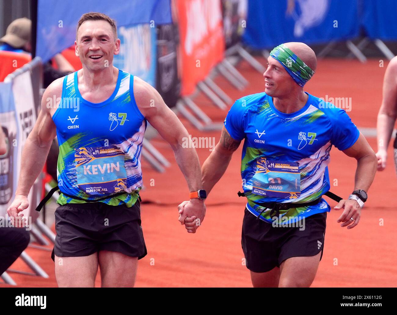 Kevin Sinfield and David Spencer (right) cross the line to complete the ...