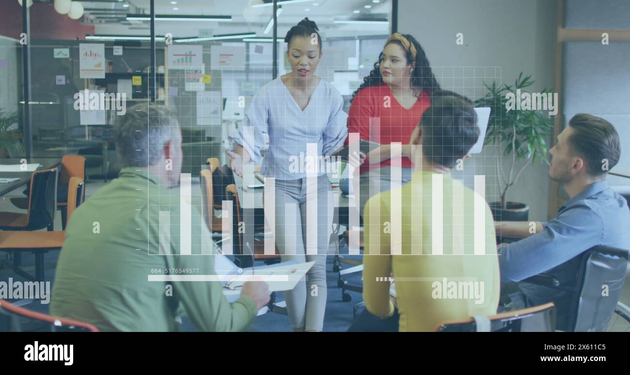 Image of graph and loading bas over diverse coworkers sharing ideas in ...