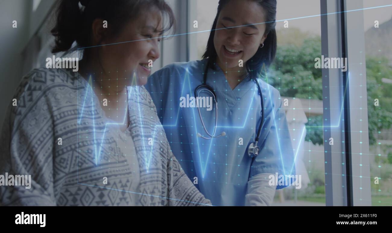 Image of heart rate monitor over asian female health worker helping ...