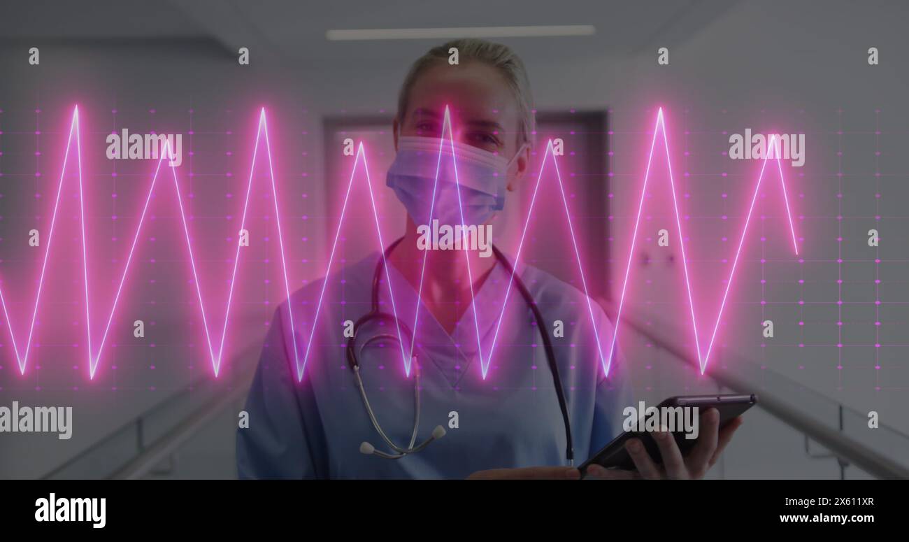 Image of heart rate monitor over caucasian female doctor wearing ...