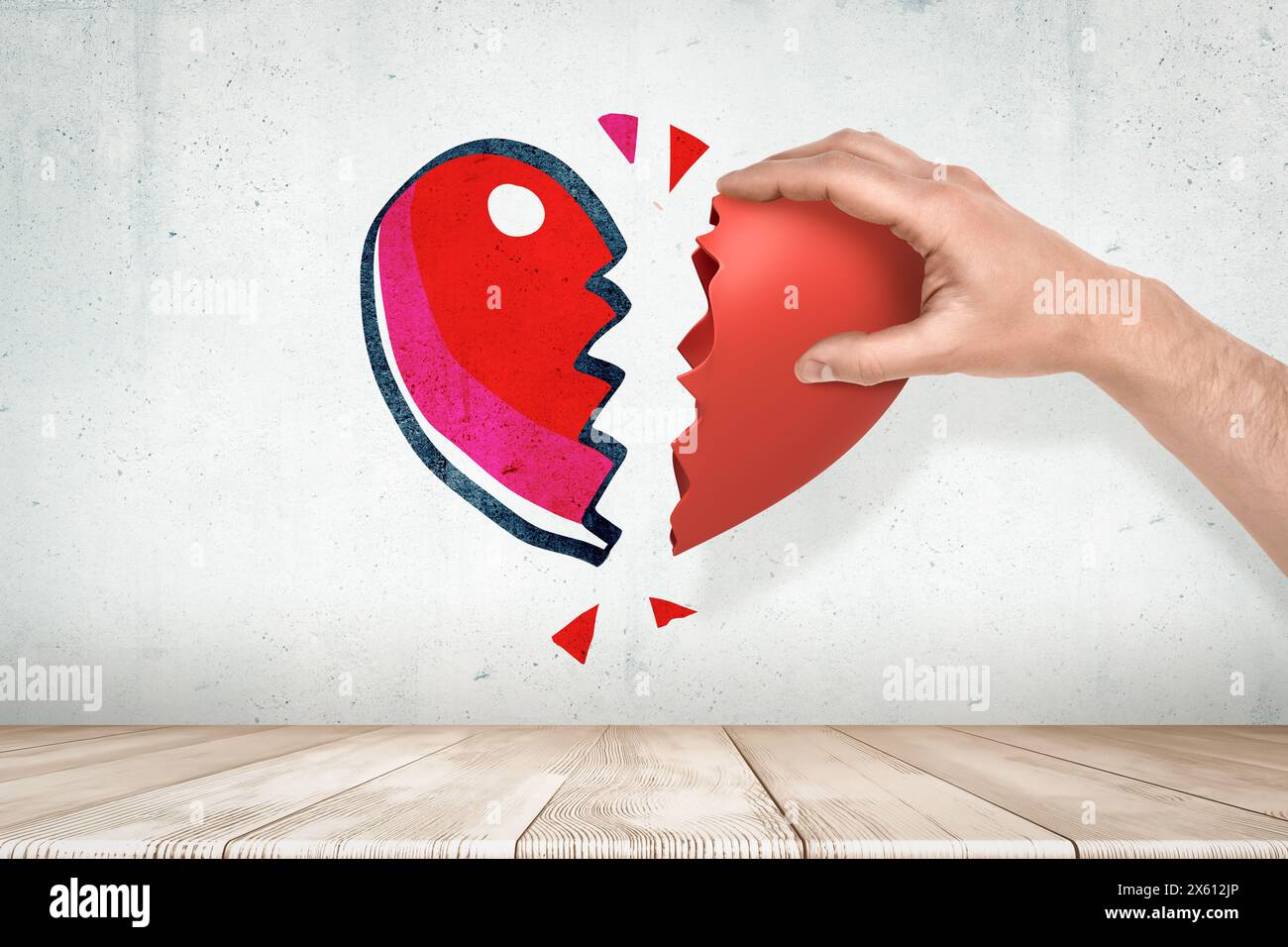 Hand holding a broken heart against graphic backdrop Stock Photo - Alamy