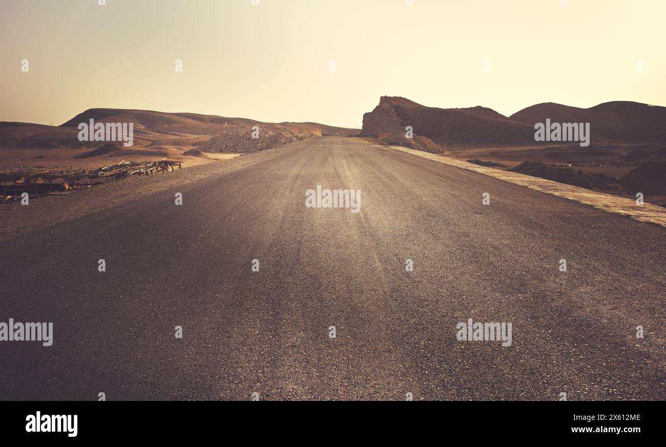 Desert asphalt road, travel concept, front focus on asphalt, color ...