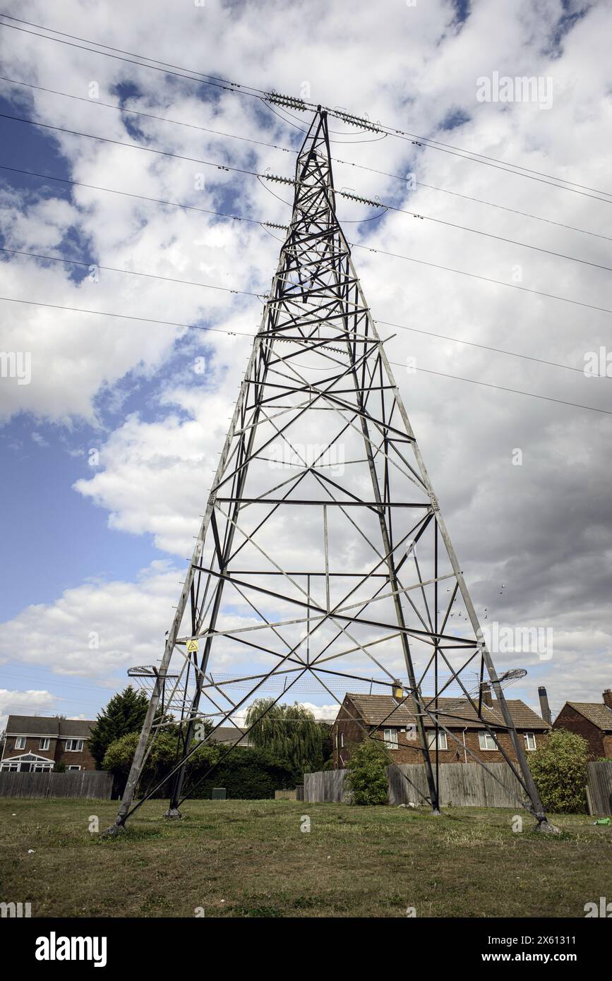 Electricity pylon and high voltage power lines in residential area ...