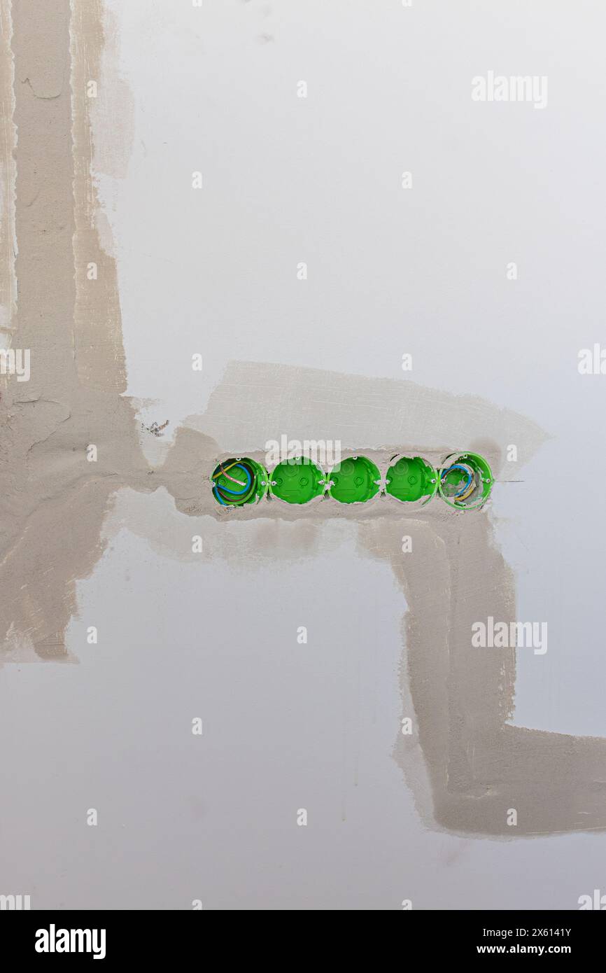 mounted socket outlets in the wall, five pieces, vertical photo Stock ...