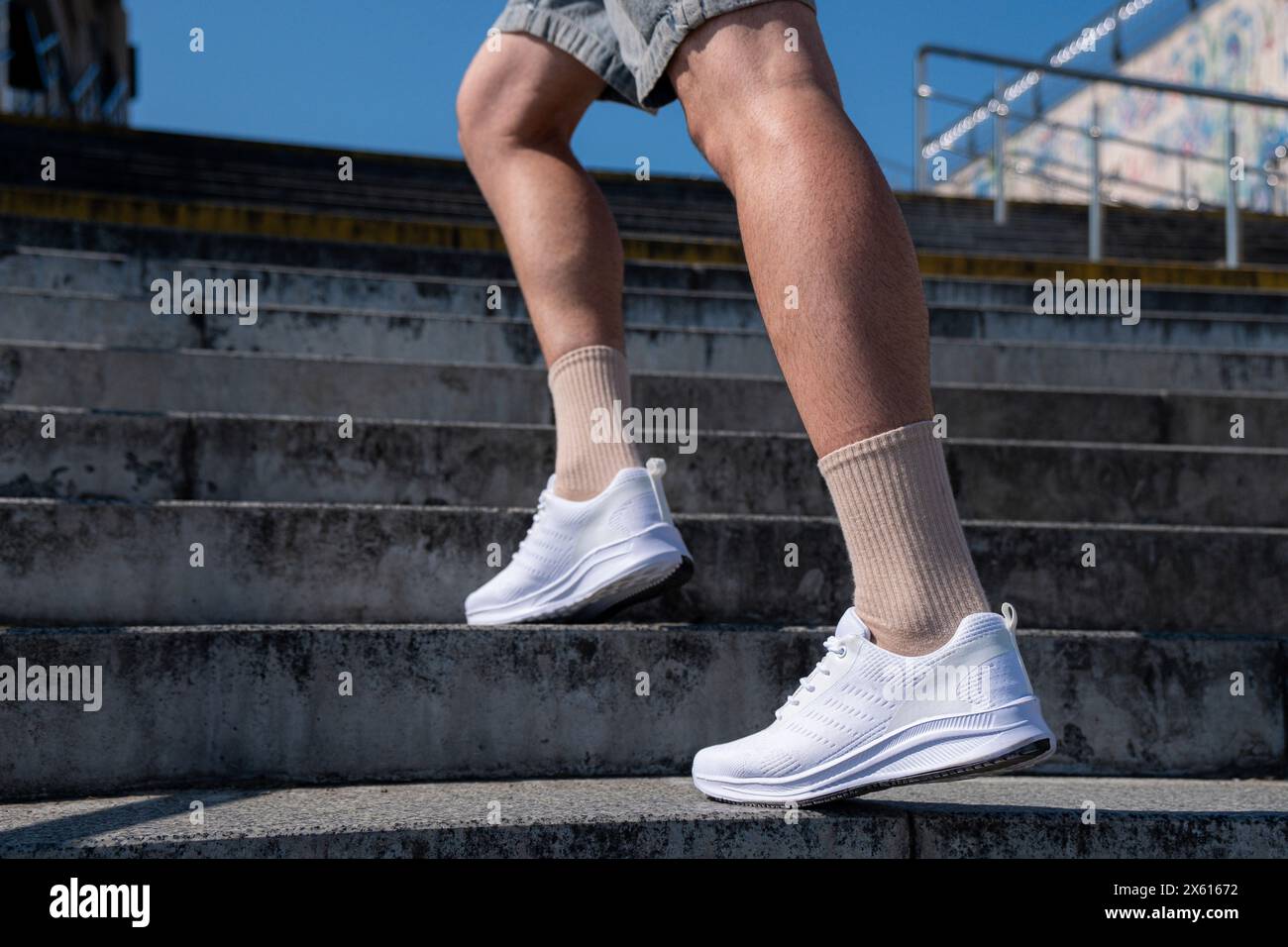 Muscular man walking around the city hi-res stock photography and ...