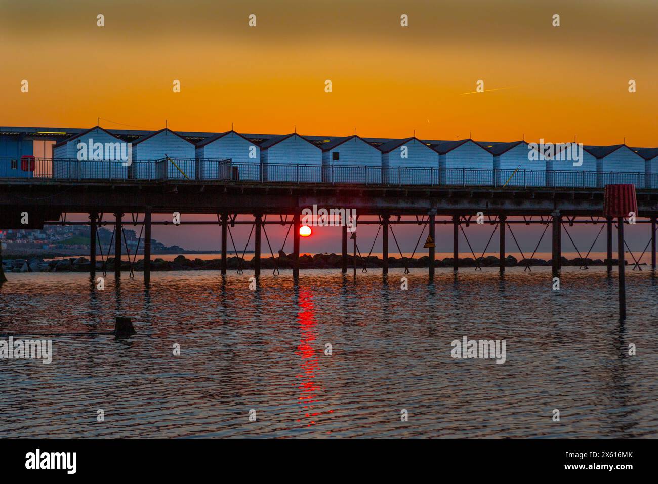 A view of a sunset under Herne Bay Pier, Kent, England Stock Photo - Alamy