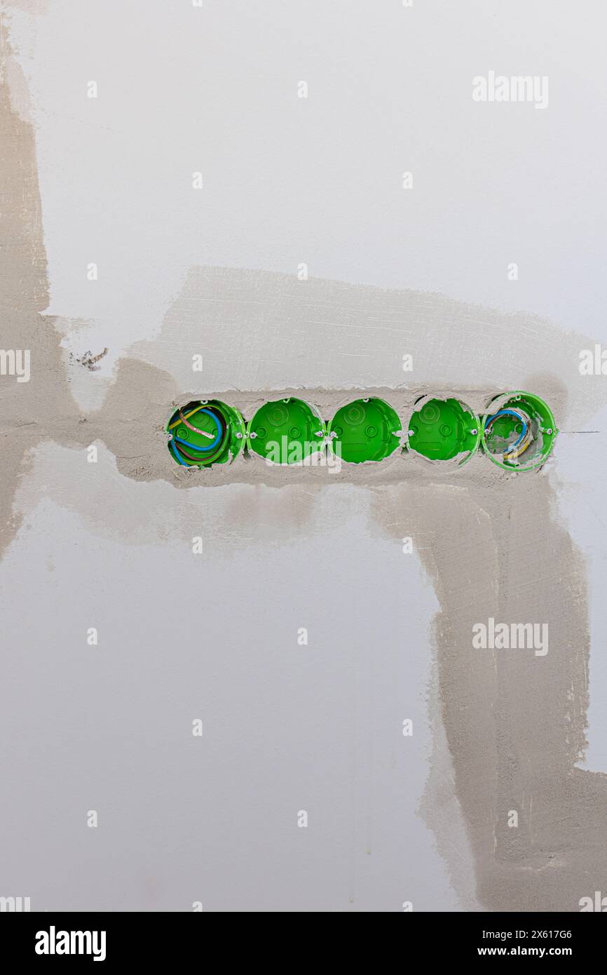 mounted socket outlets in the wall, five pieces, vertical photo Stock ...